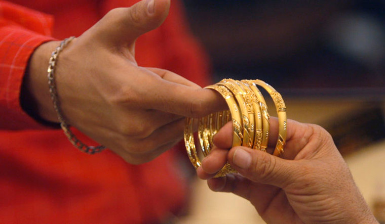Cash-crunched Indians are increasingly pledging gold to run their days ...