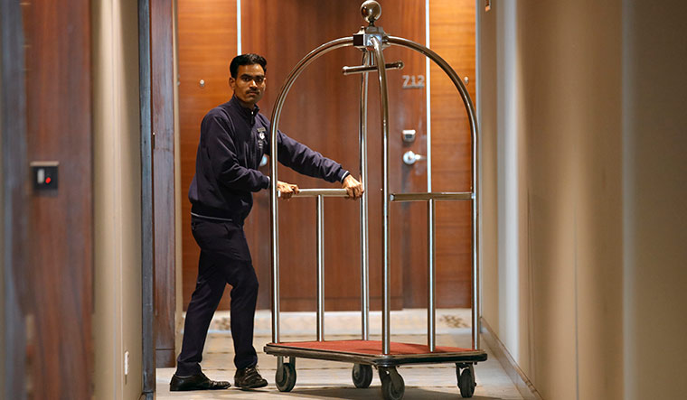 Bell desk attendant Asharam believes work is work- The Week