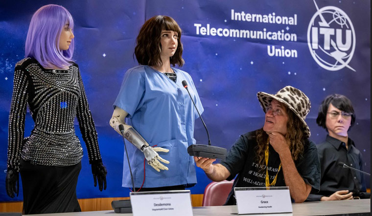 Not planning to rebel against humans, or steal jobs, say robots at AI ...