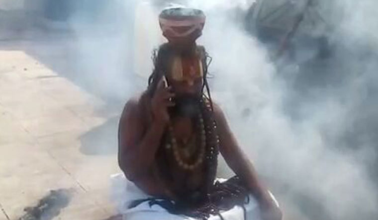 Computer Baba performs pooja on roof of govt guest house- The Week