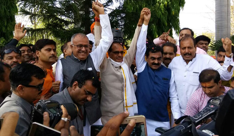 Buoyed by exit polls, opposition BJP out to corner Cong govt in MP- The ...