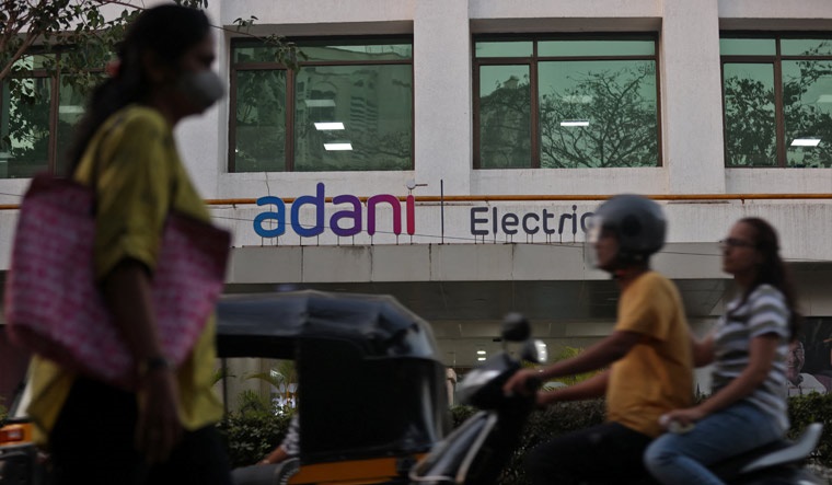 Adani Group shares fall again amid Moody's downgrade, report of ...