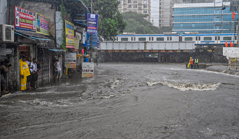 Heavy rain lashes Mumbai, many areas inundated, local train services hit- The Week