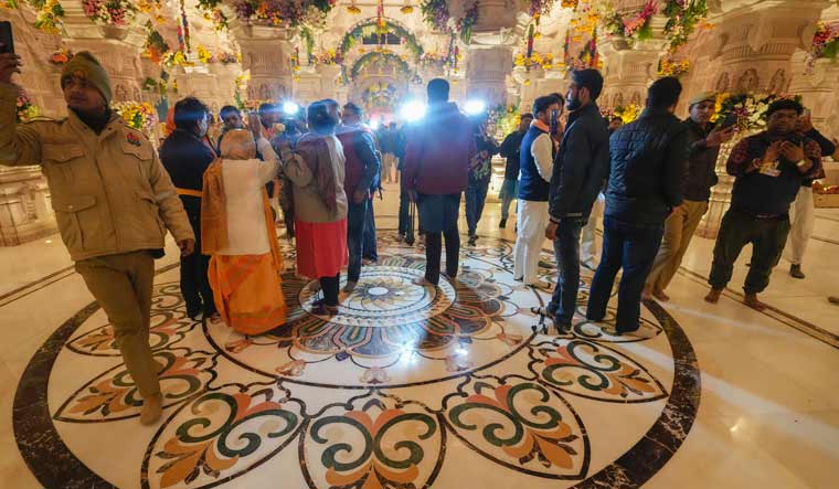 Thousands throng Ayodhya Ram Mandir to offer prayers a day after 'Pran ...