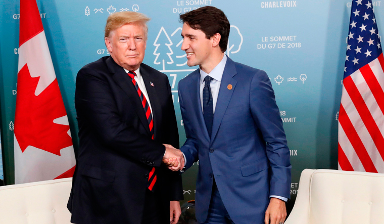 Trump, Trudeau swap jokes but hold firm in trade dispute- The Week