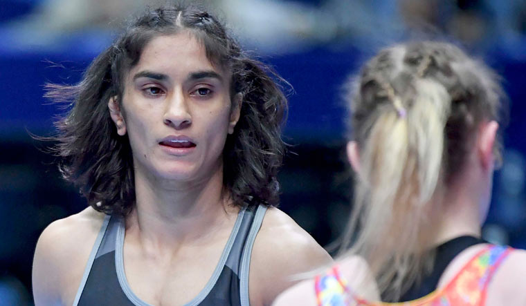 World Wrestling C'ship: Vinesh locks Olympic quota with bronze medal ...