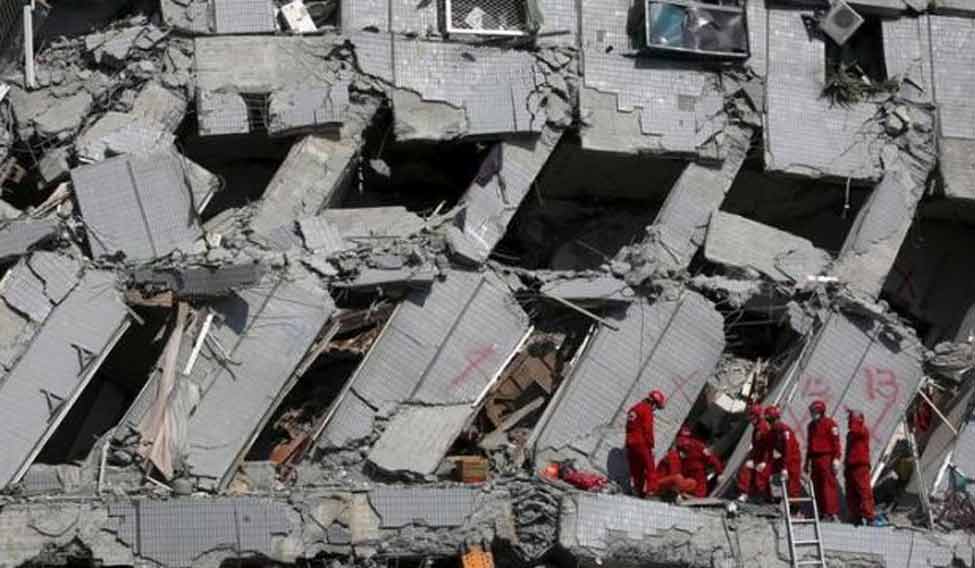 Woman pulled alive from rubble