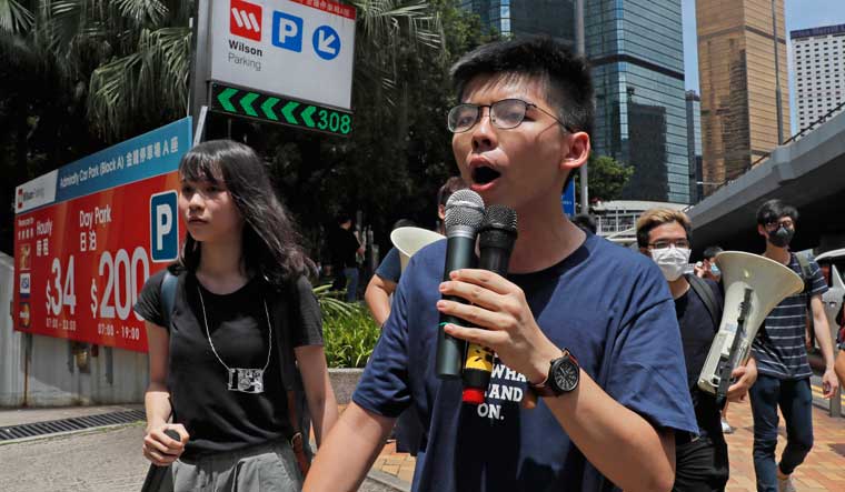 Hong Kong: 2 protest leaders arrested, Chinese anti-riot drill in ...