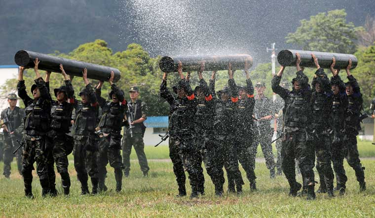 Former Xinjiang official takes charge of Hong Kong garrison- The Week