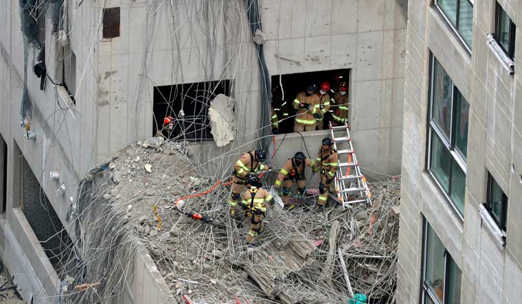 S.Korean rescuers locate man at collapsed construction site- The Week