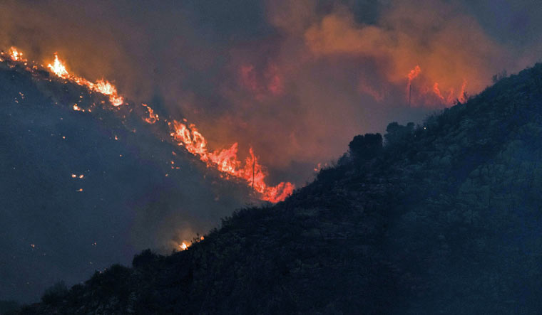 Spain wildfires: 20 injured after jumping out of train surrounded by ...