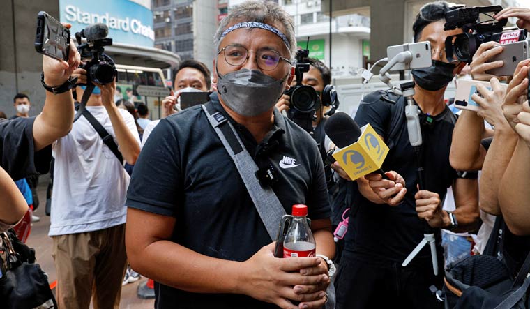 Hong Kong journalist charged with police obstruction- The Week