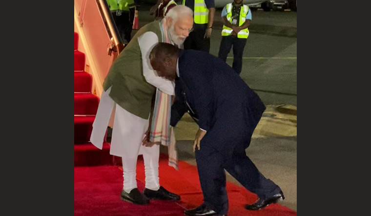 Papua New Guinea PM touches Modi's feet on his arrival- The Week