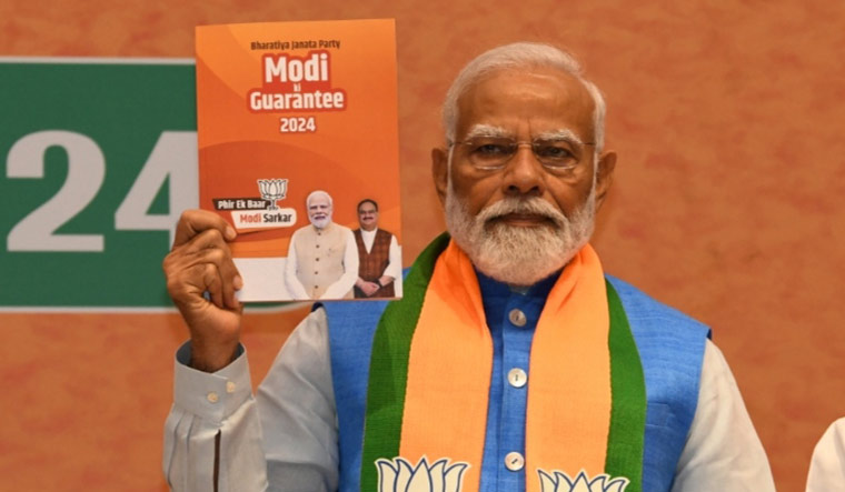 BJP manifesto promises to scale up existing schemes; Modi calls them ...