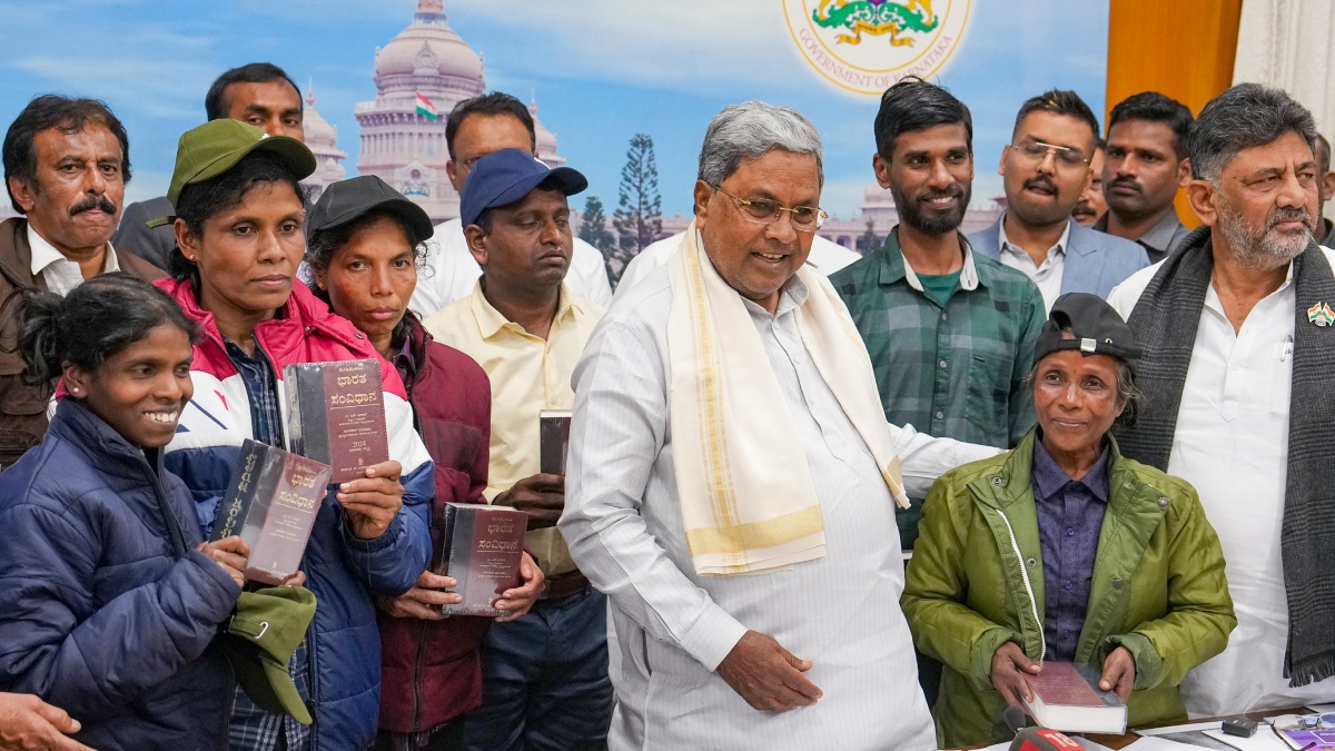 Karnataka: CM Siddaramaiah hands over a copy of Indian Constitution to ...