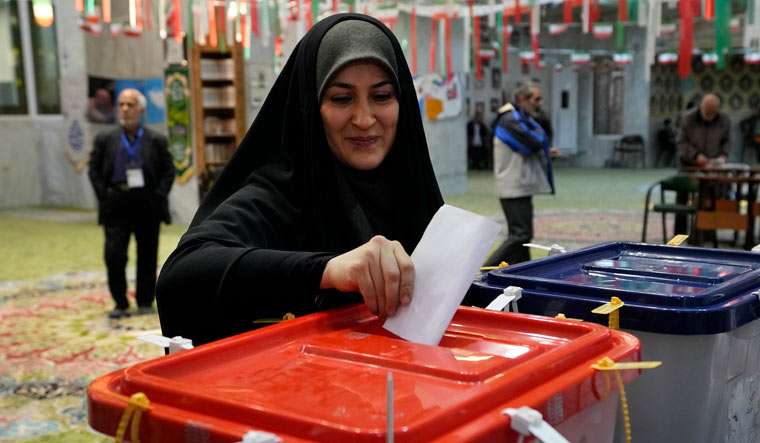 Amid boycott calls, Iranians vote in parliamentary polls for first time ...