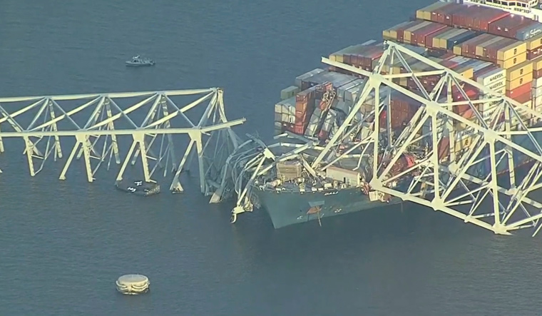 Baltimore bridge collapse: Two people rescued, tide hinders search ...